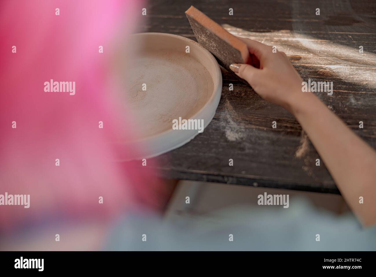 Female artisan working manually with earthenware in workshop Stock ...