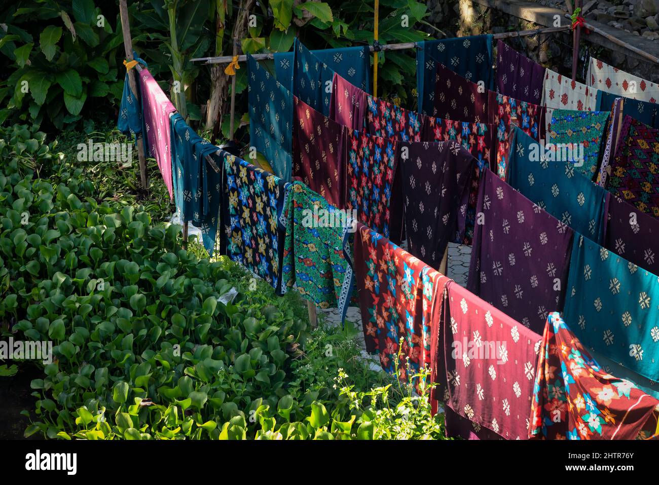 Colourful sarongs on clothesline Stock Photo - Alamy
