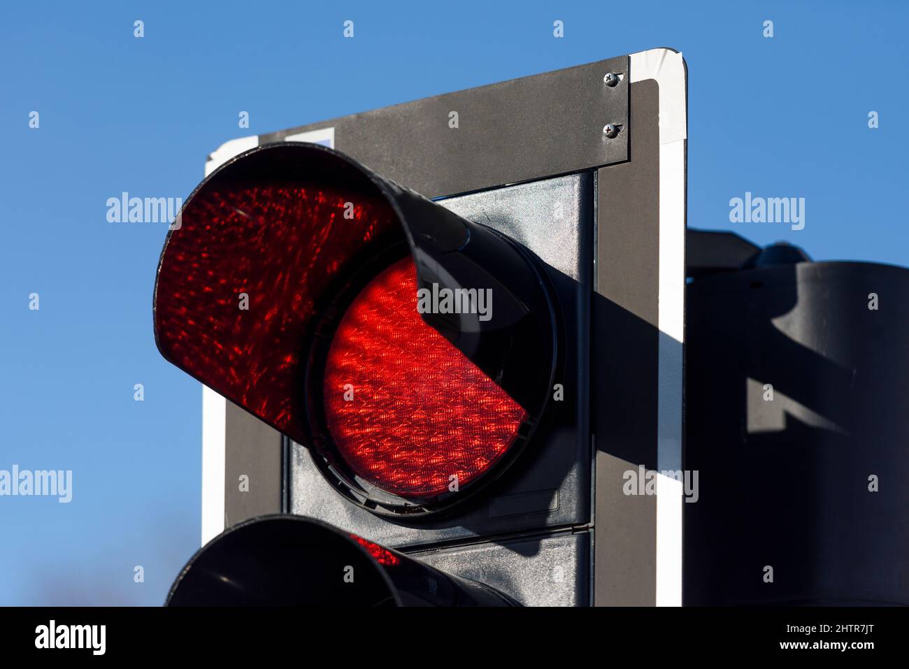 Traffic light with red light against the evening sky Stock Photo - Alamy