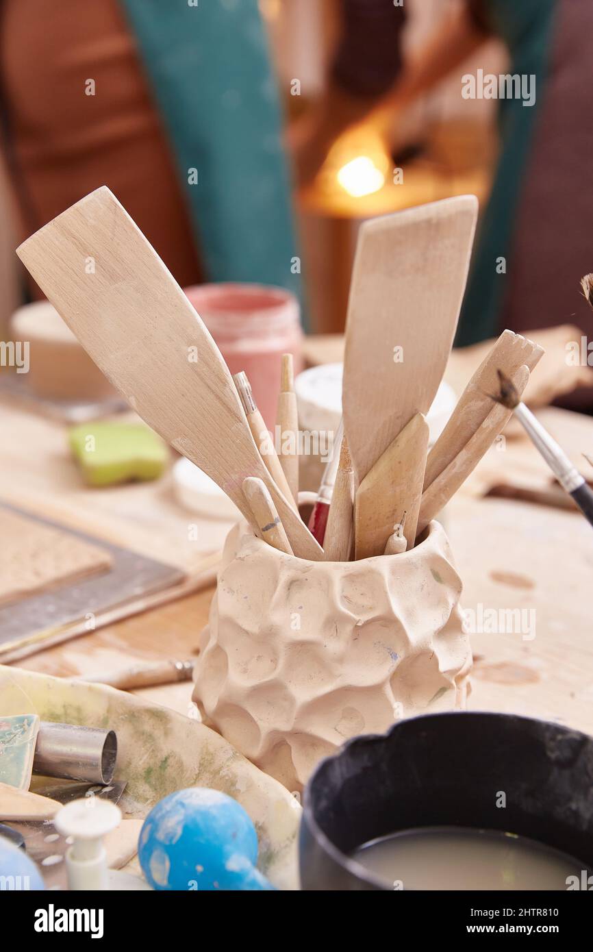 Wooden spatulas in a stand for leveling ceramics when sculpting Stock ...