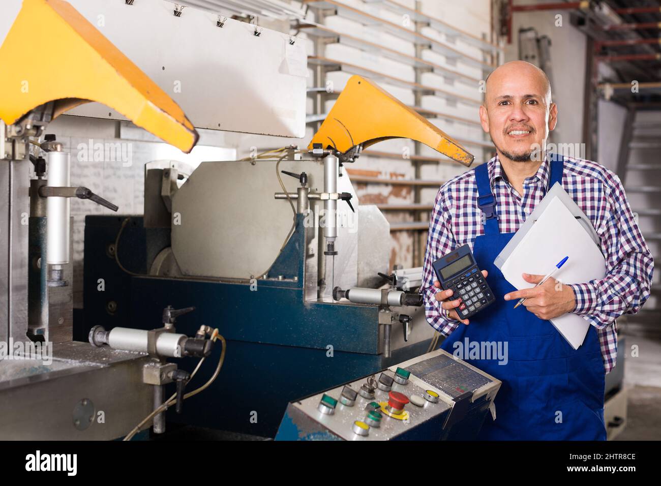 guy at professional lathe Stock Photo - Alamy