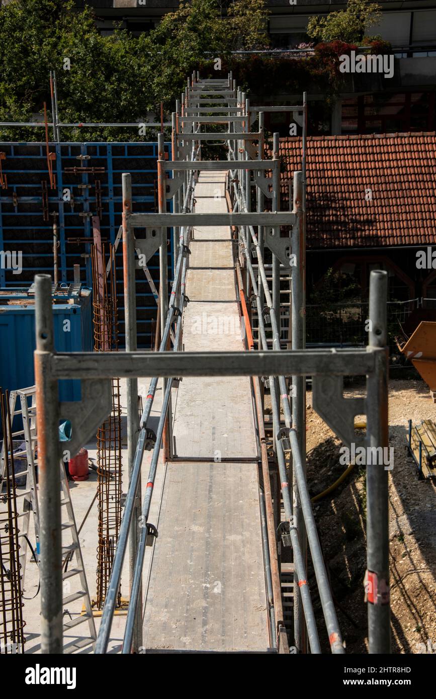 view from above over a metal scaffold with wooden planks at a ...