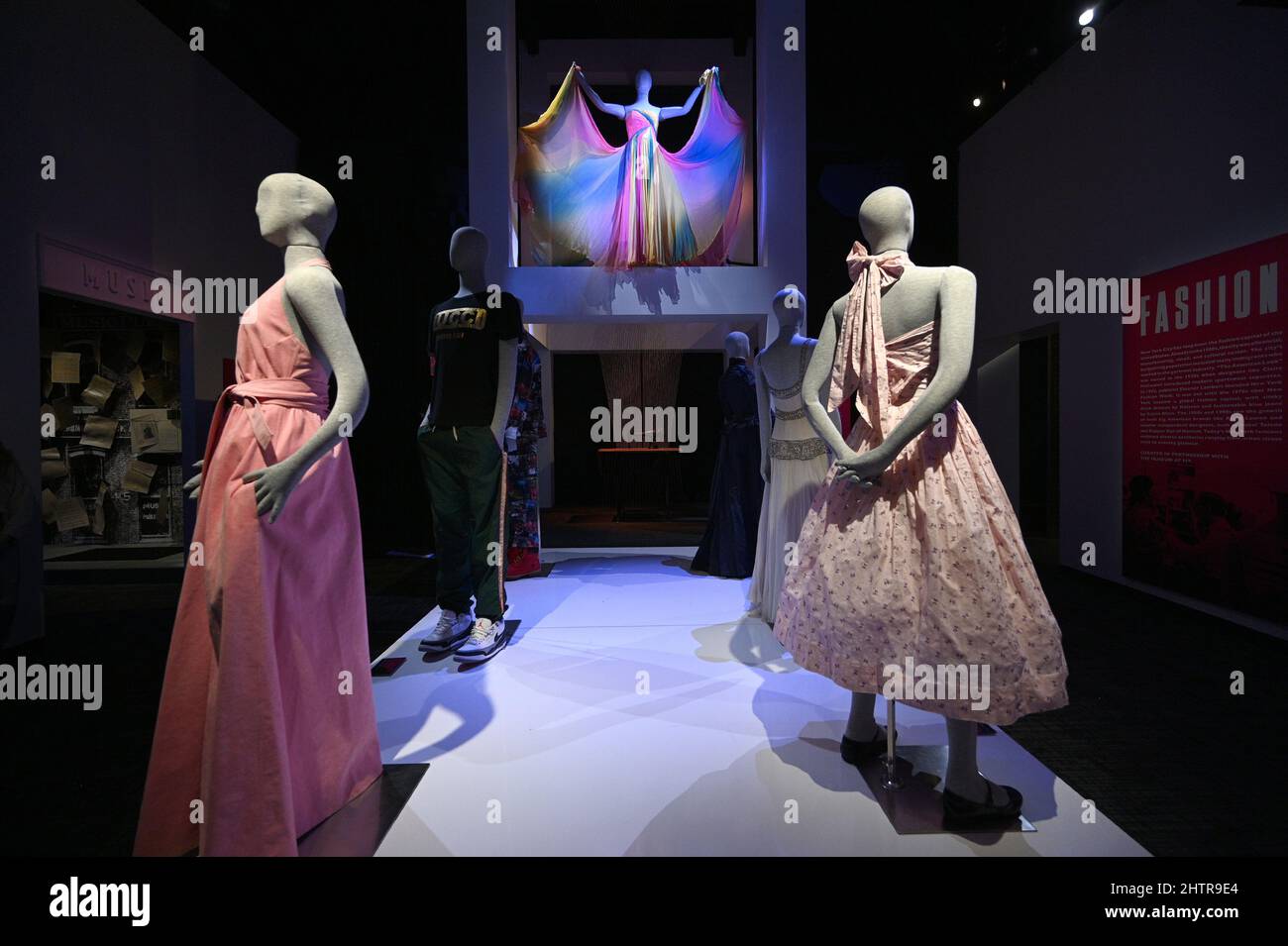 Mannequins wears a colorful dress at the “Fashion” museum exhibition ...