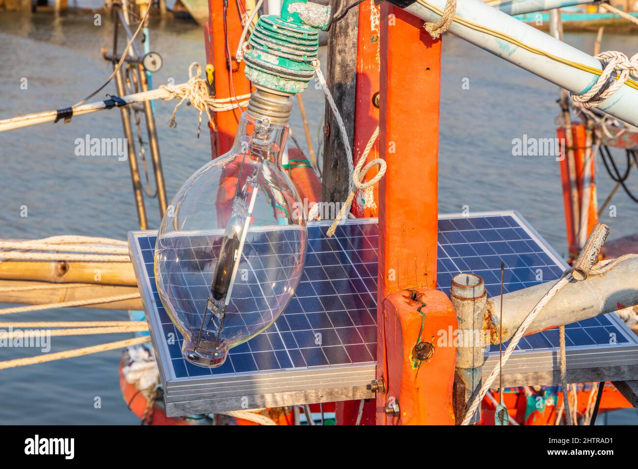 A halogen lamp with a solar battery charging station on the deck of a ...