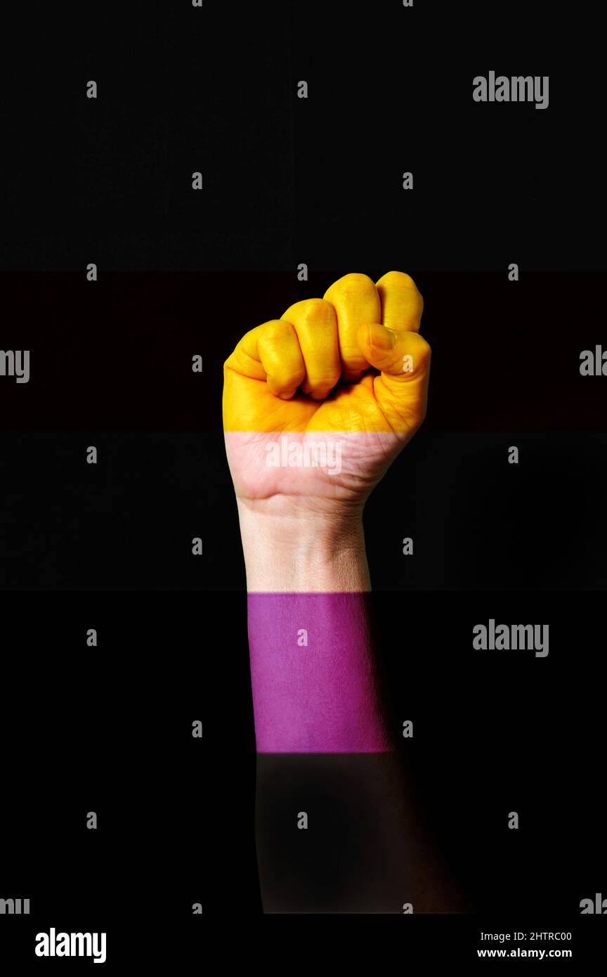 Hand with non-binary pride flag patterned isolate on black -LGBTQ ...