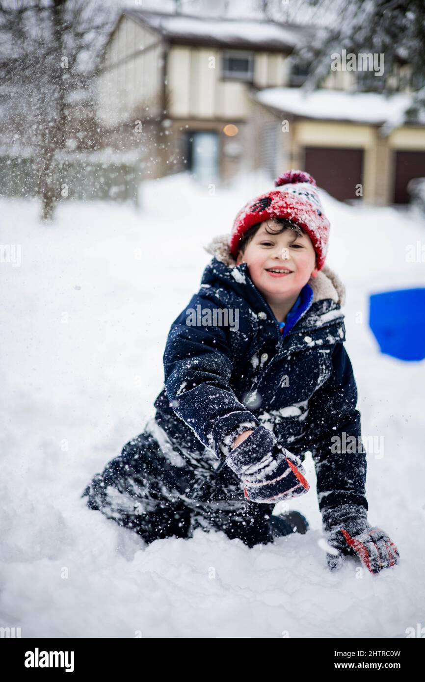 A boy playing in the snow hi-res stock photography and images - Alamy