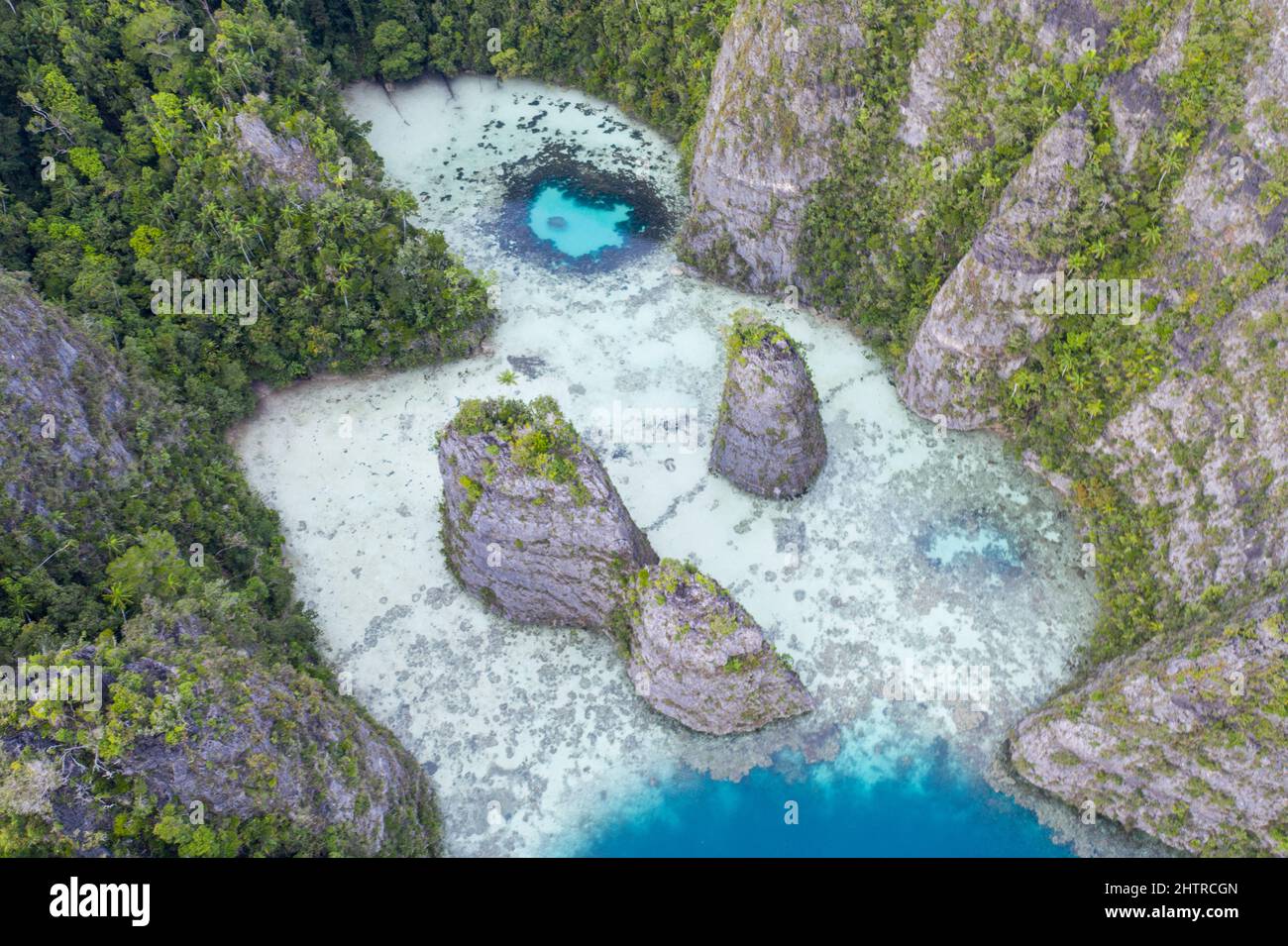Warm seas surround remote limestone islands in Raja Ampat, Indonesia ...