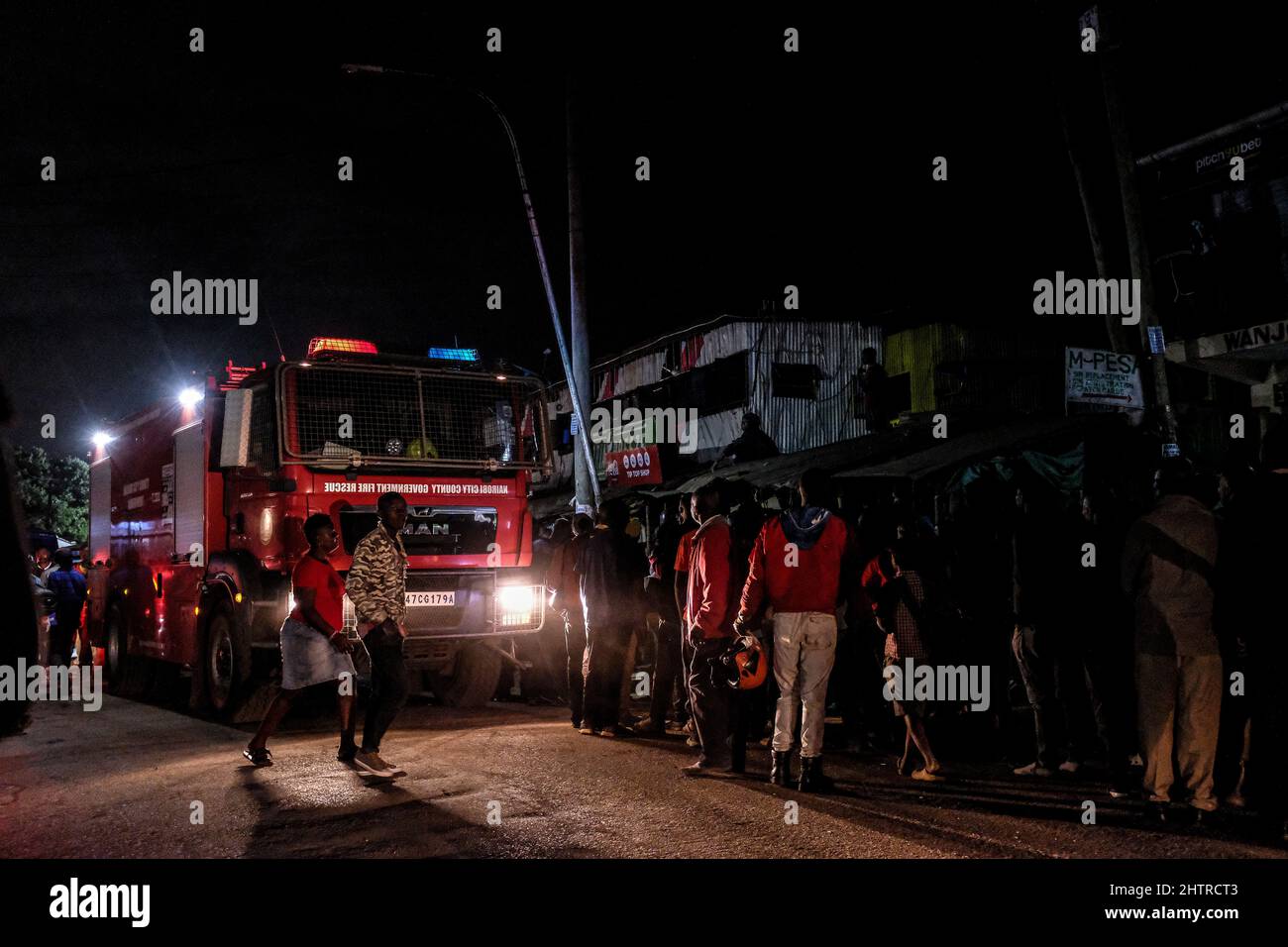Nairobi, Kenya. 1st Mar, 2022. Residents watch from a distance as ...