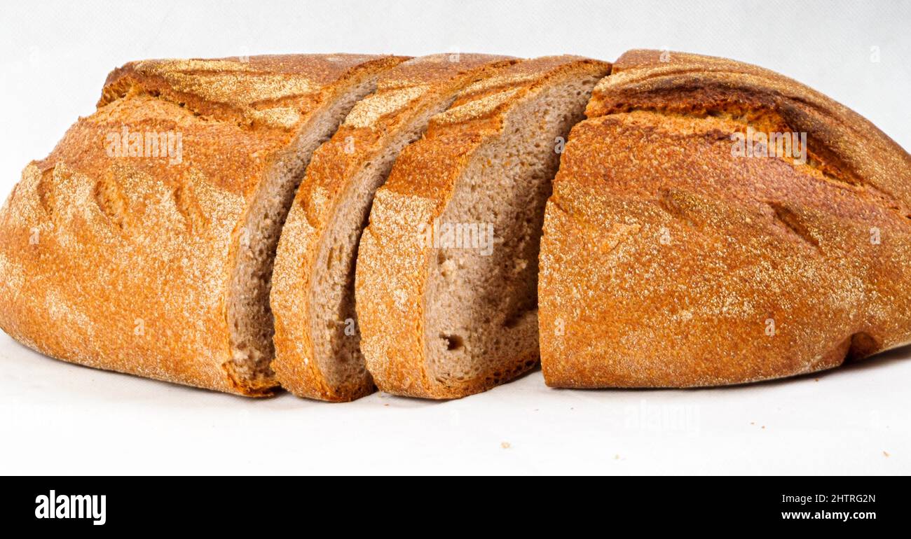 Closeup shot of the farro and spelt bread cut in pieces isolated on the ...