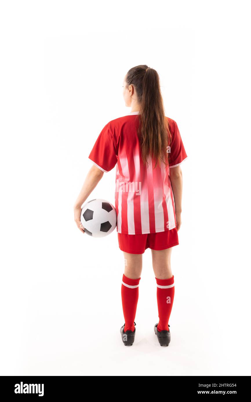 Full length rear view of caucasian young female player with soccer ball ...