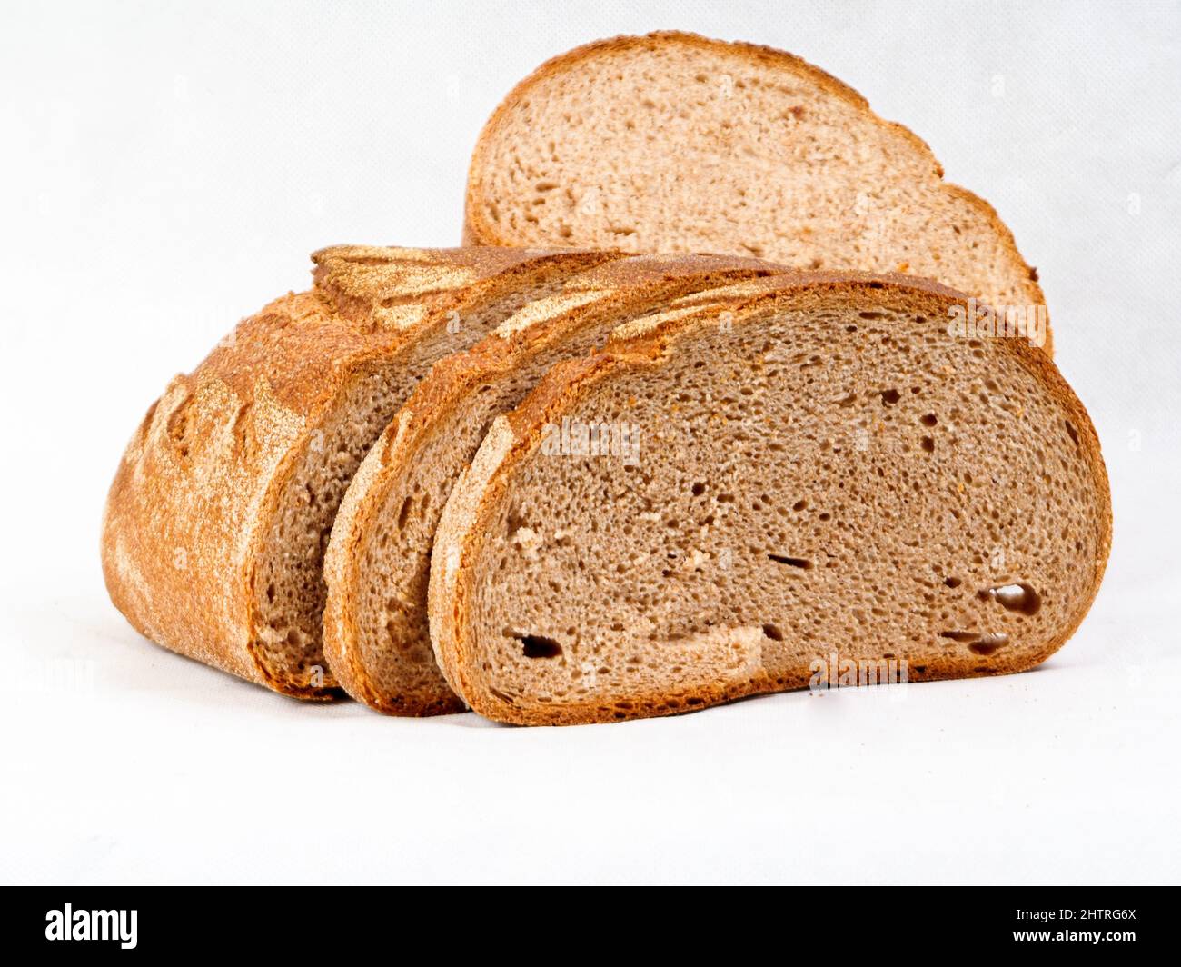 Closeup shot of the farro and spelt bread cut in pieces isolated on the ...