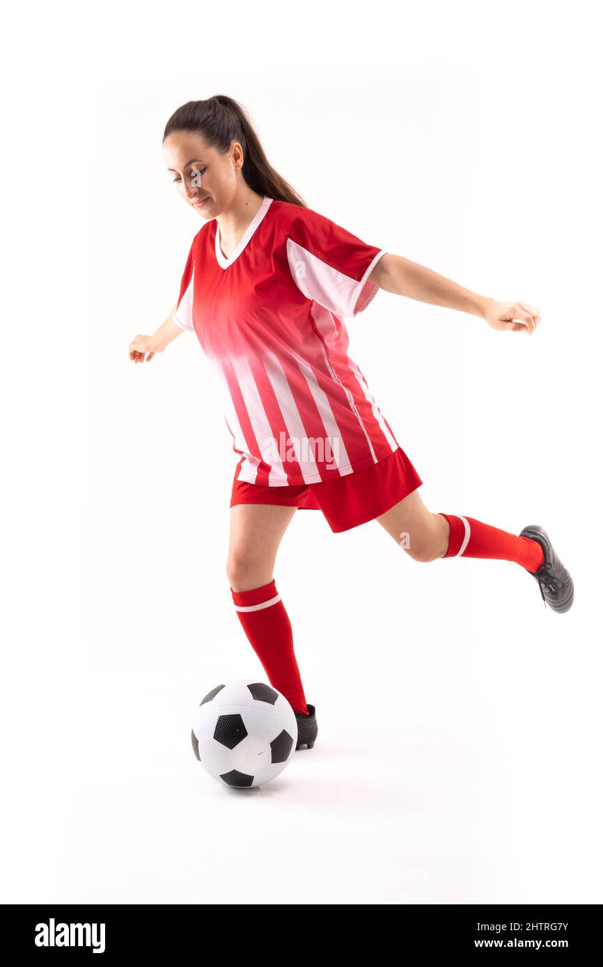 Caucasian young female player with arms outstretched playing soccer ...