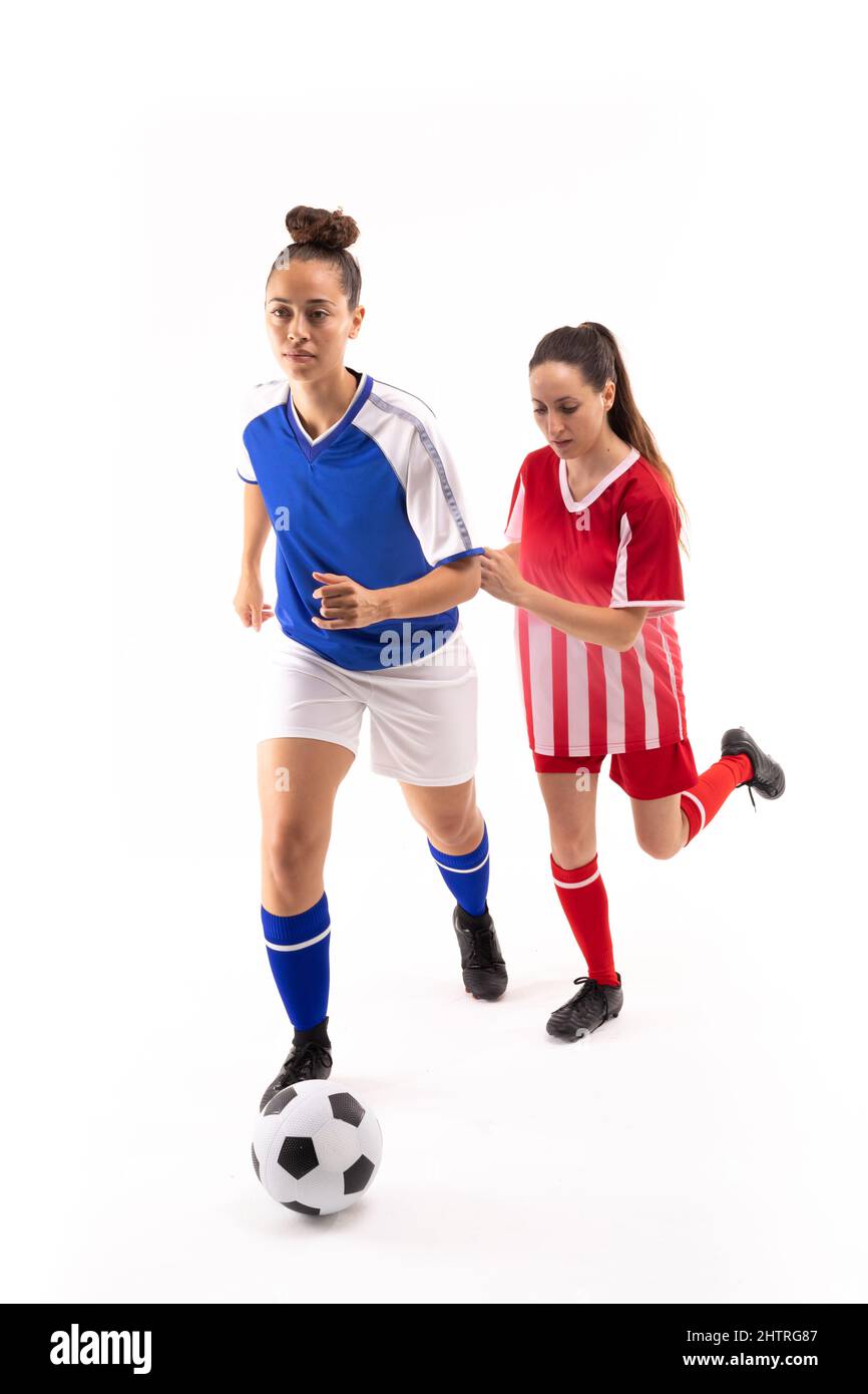 Full length of biracial and caucasian young female players playing ...