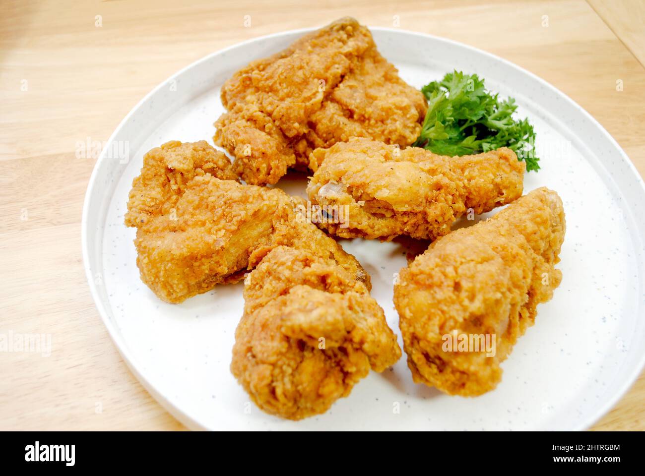 Eating Southern Fried Chicken Pieces Stock Photo - Alamy