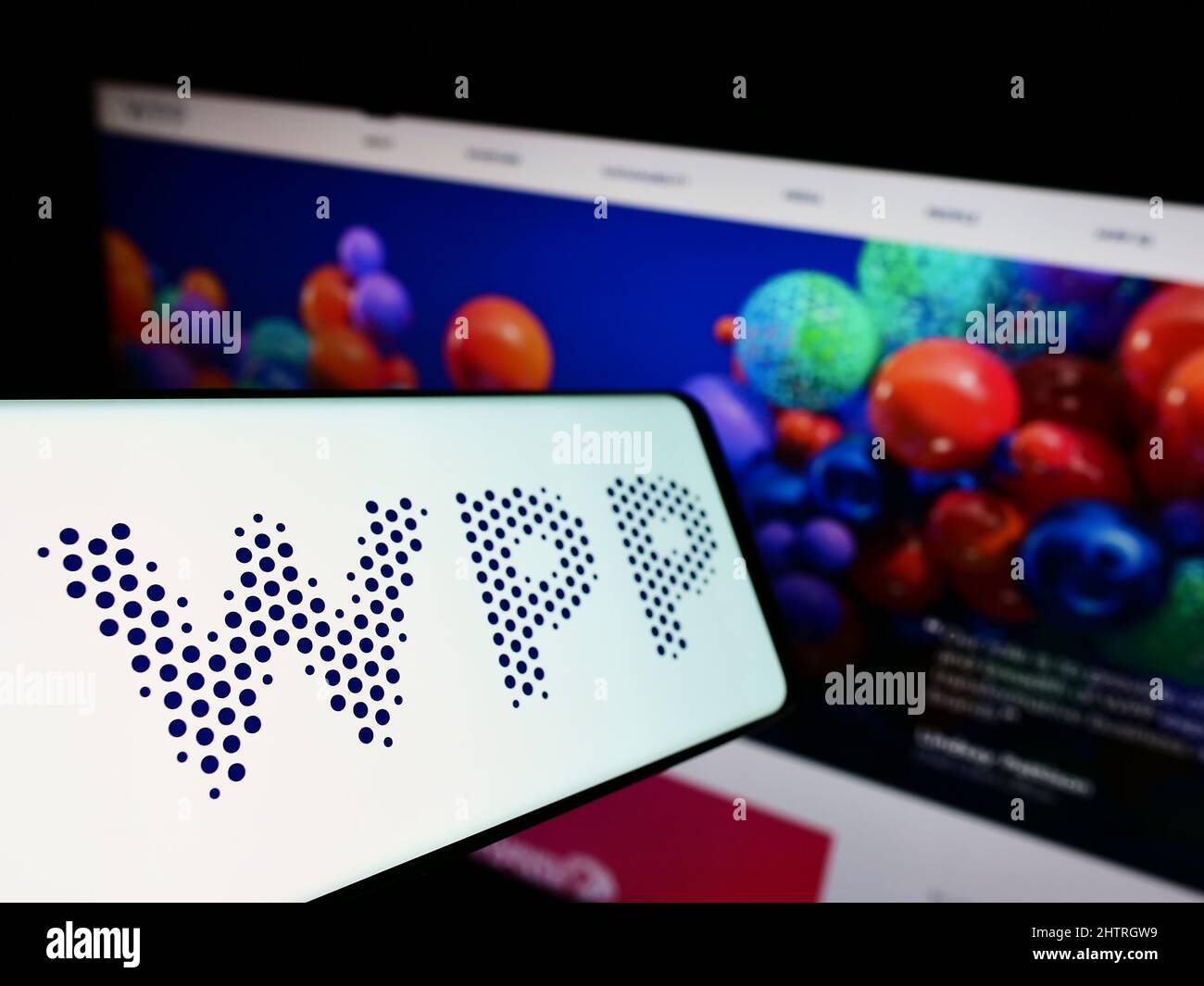 Smartphone with logo of British advertising company WPP plc on screen ...
