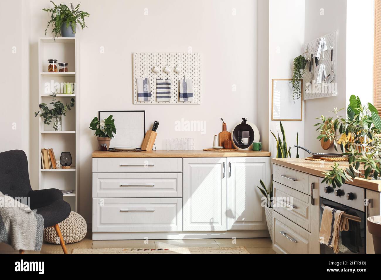 Interior of light kitchen with stylish counters Stock Photo - Alamy