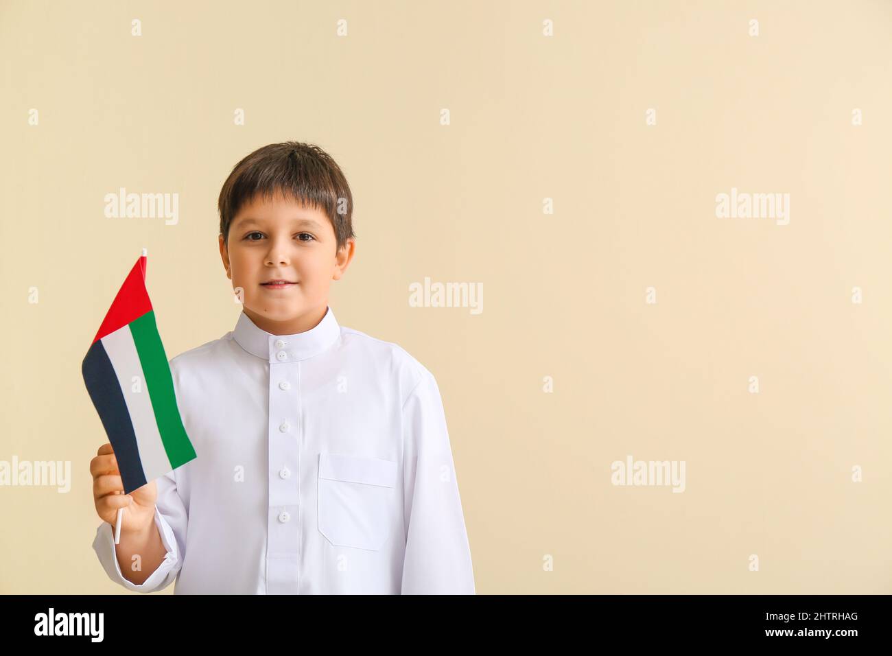 Cute little boy with national flag of UAE on light background Stock ...