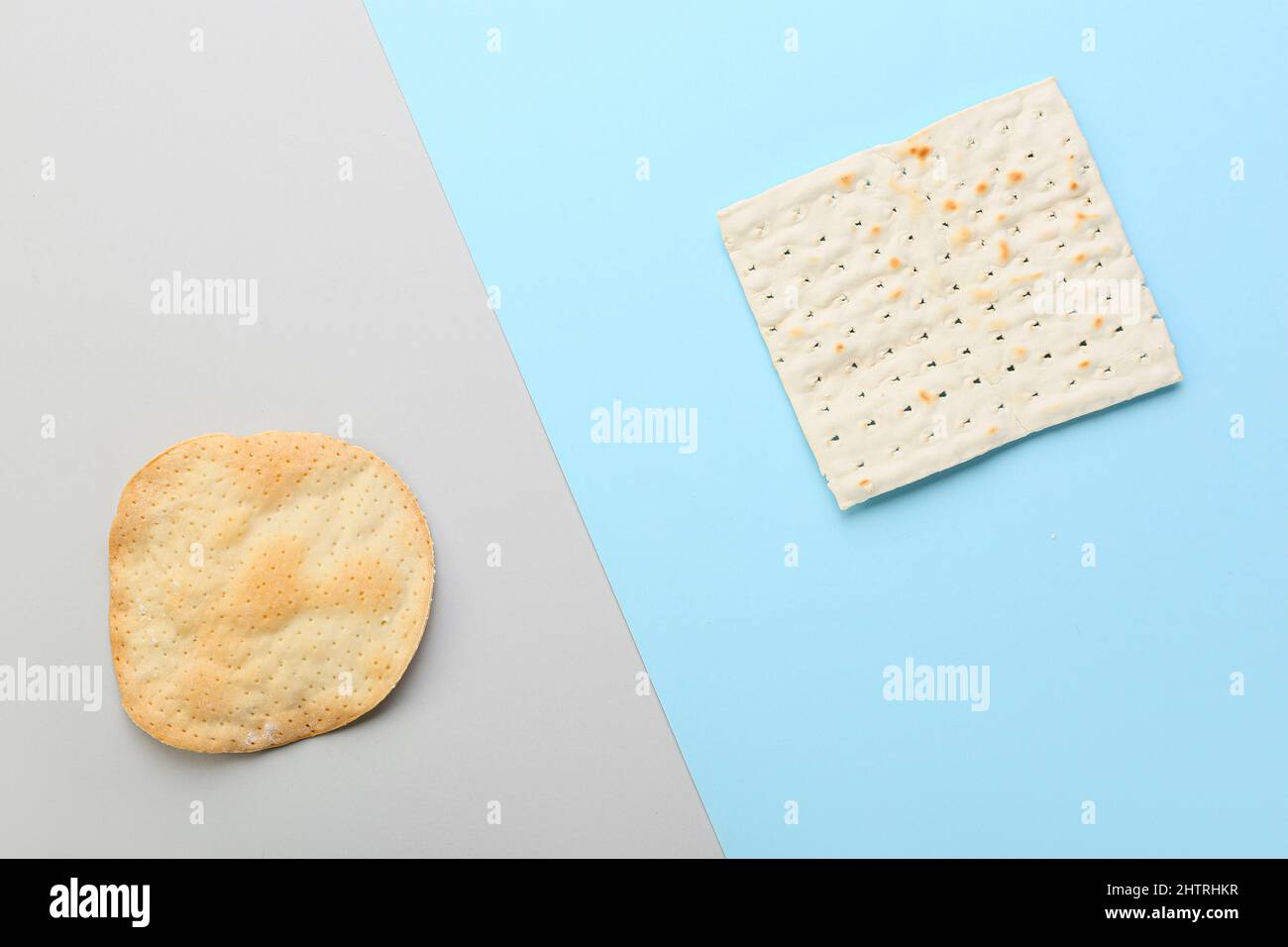 Different Jewish flatbread matza for Passover on color background Stock ...