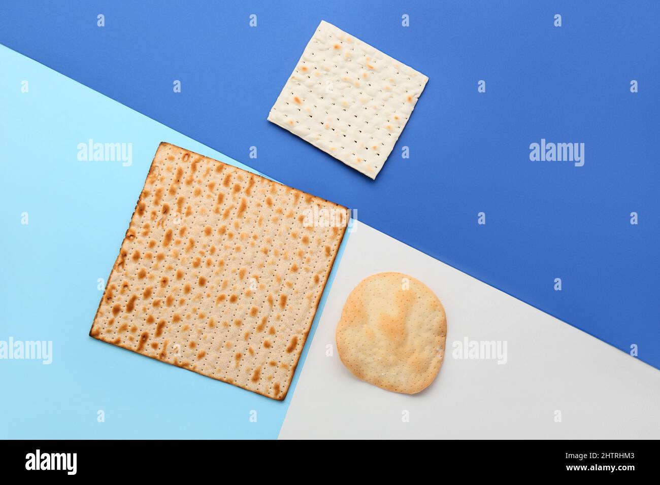 Different Jewish flatbread matza for Passover on color background Stock ...