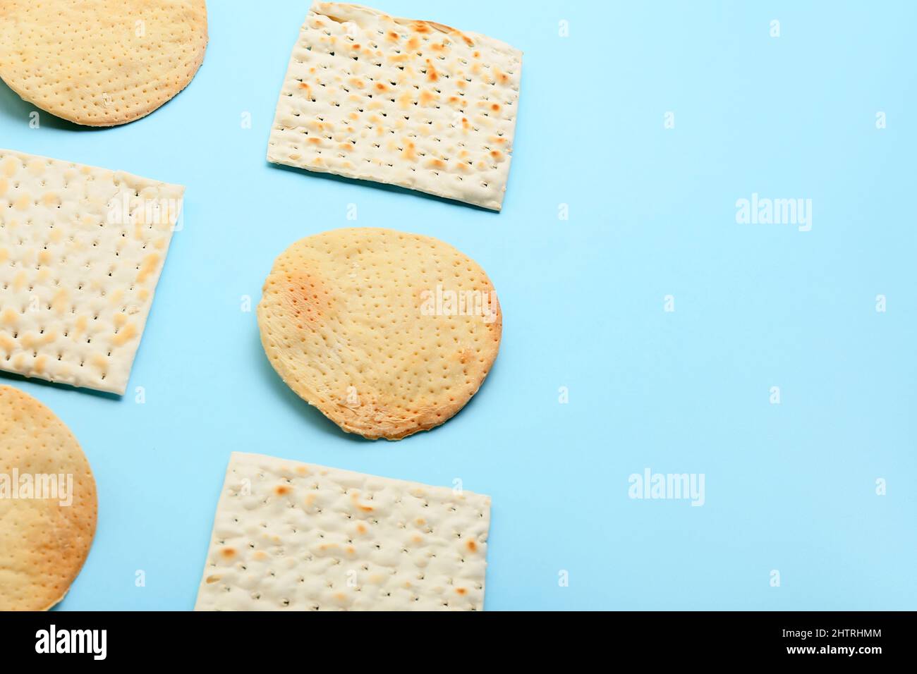 Different Jewish flatbread matza for Passover on color background Stock ...