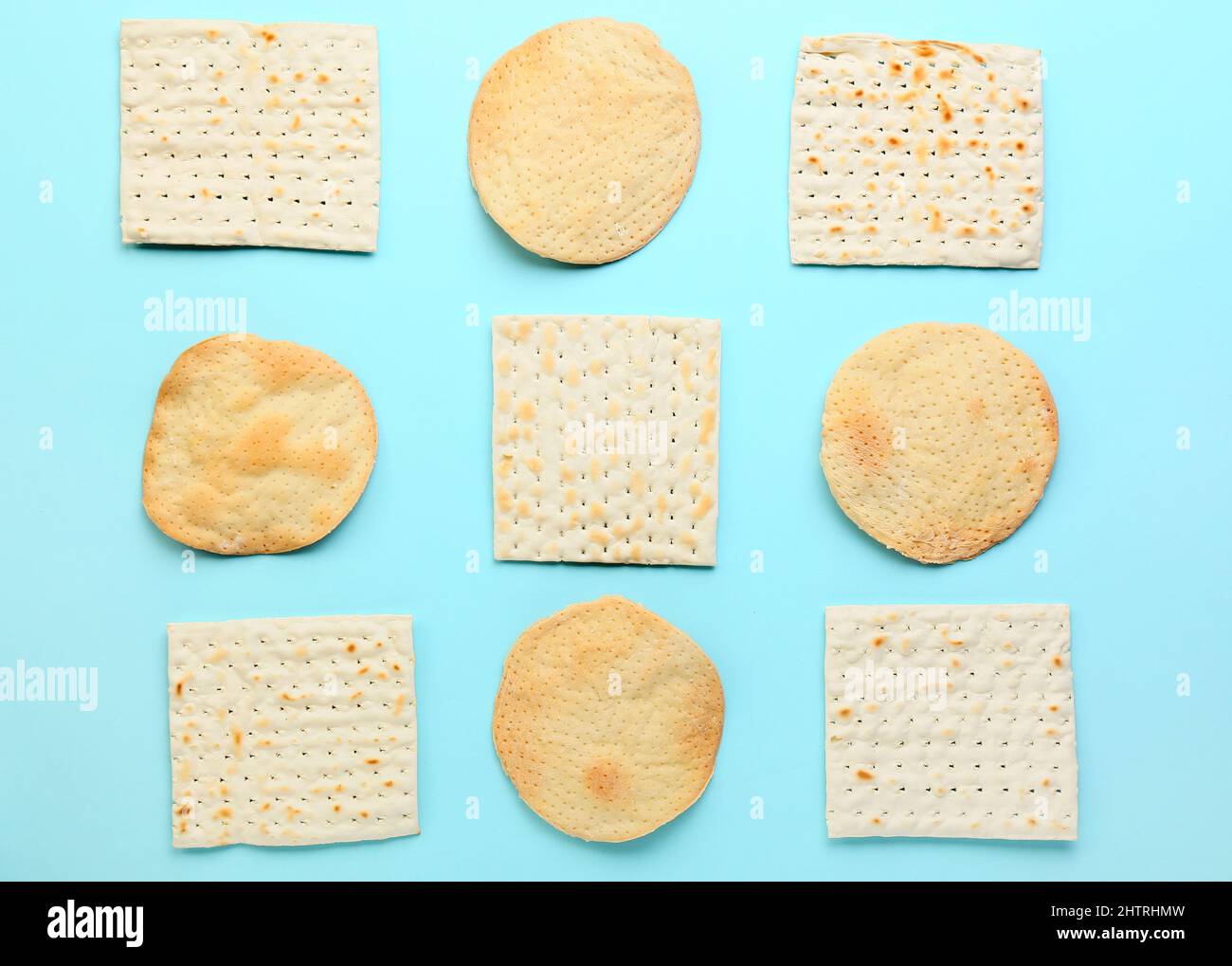 Different Jewish flatbread matza for Passover on color background Stock ...