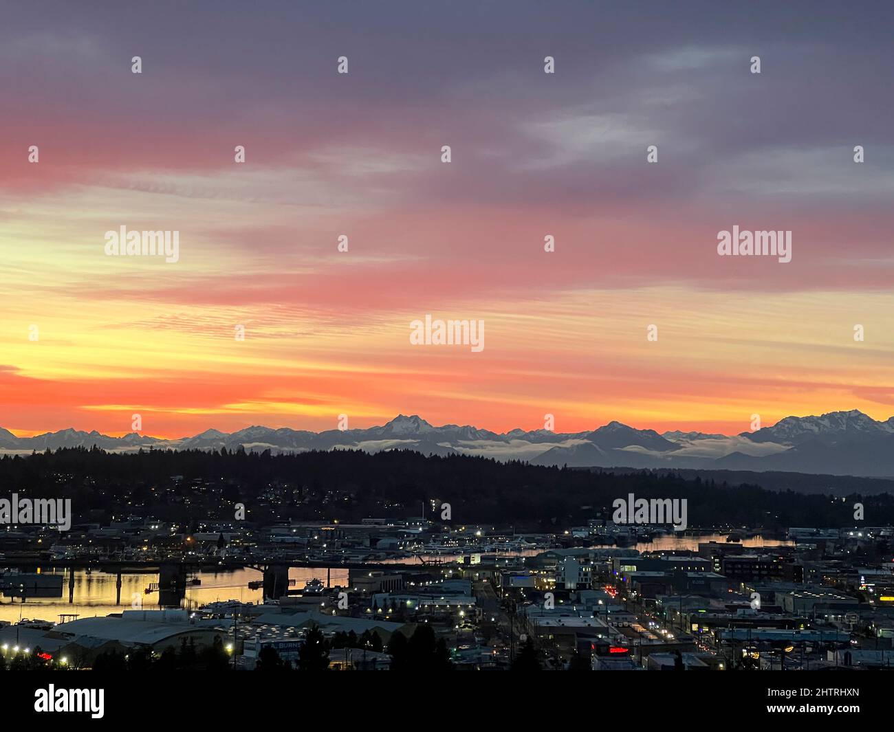 Sunset over the Olympic Mountains and Ballard in Seattle Stock Photo ...