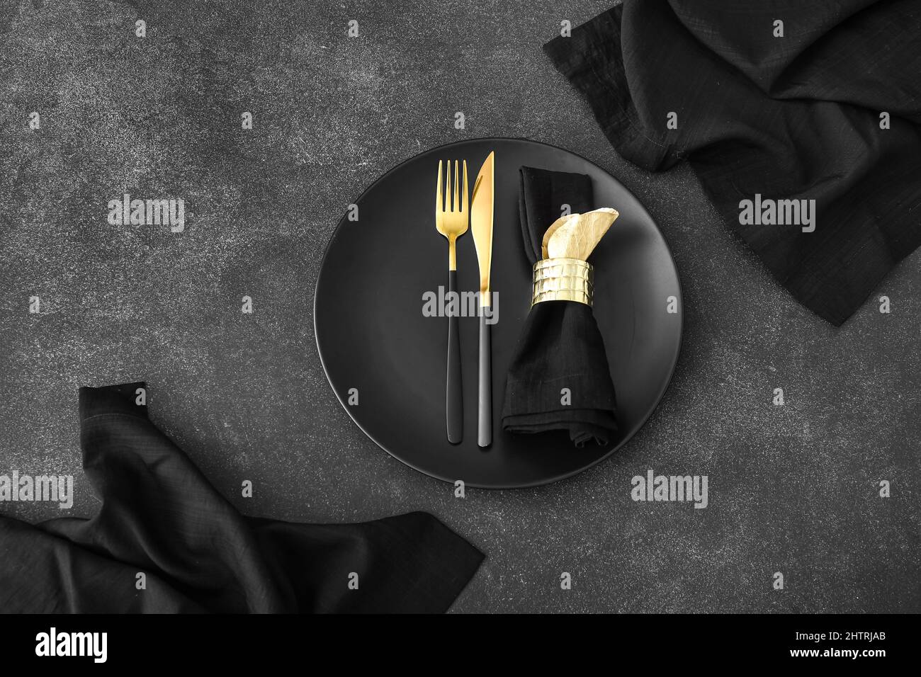 Elegant table setting on dark background Stock Photo - Alamy
