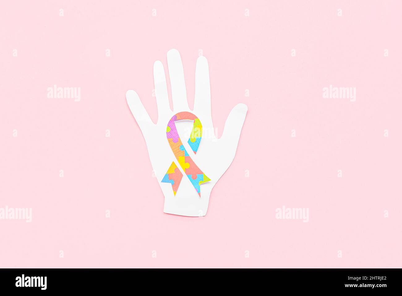 Paper human palm with awareness ribbon on pink background. Concept of ...