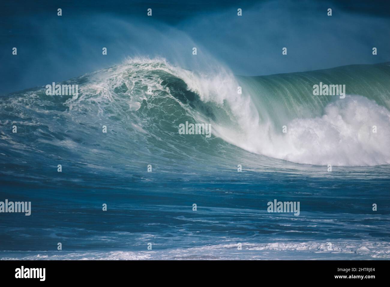 Perfect wave breaking in a beach. Surf spot Stock Photo - Alamy