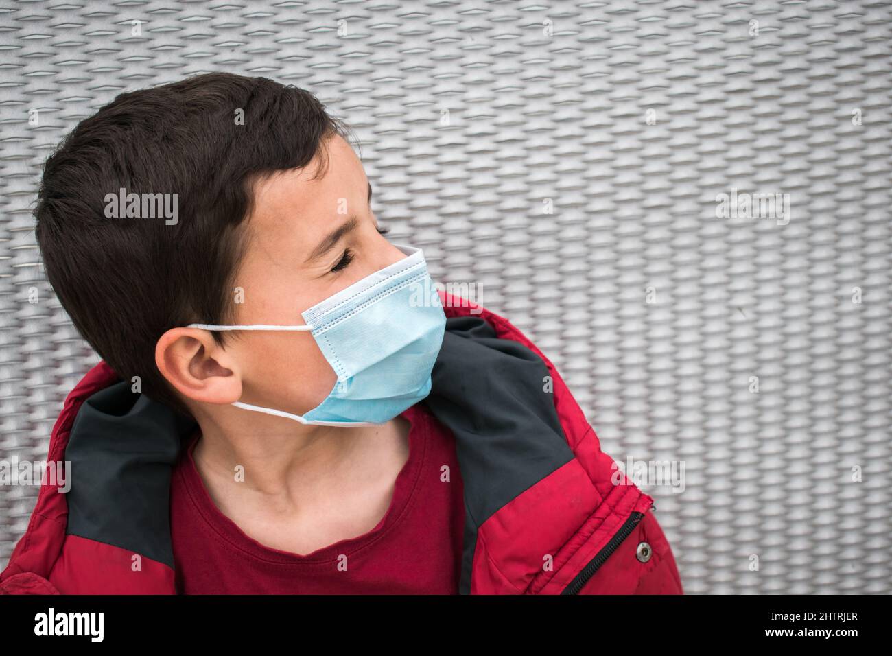 Child wearing medical mask, closed eyes expression Stock Photo - Alamy