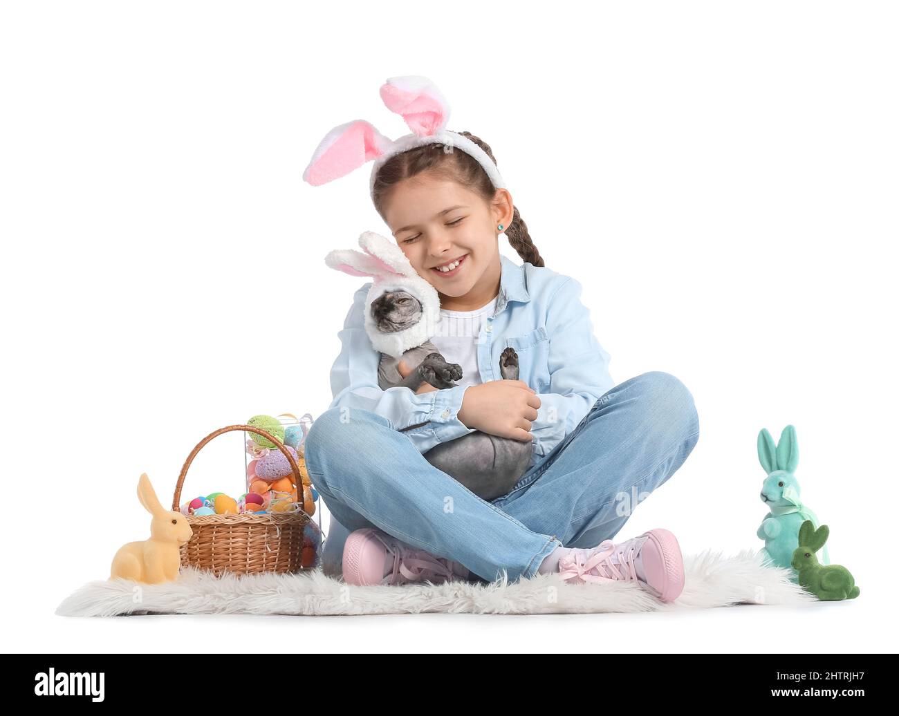 Little girl with Sphynx cat, Easter eggs and rabbits on white ...