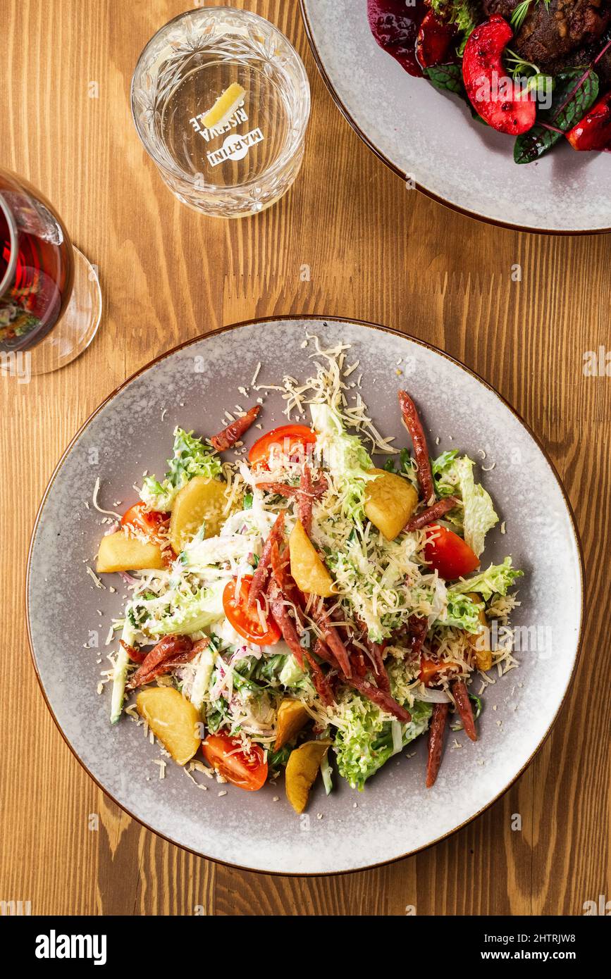 warm salad with meat and vegetables. restaurant menu Stock Photo - Alamy