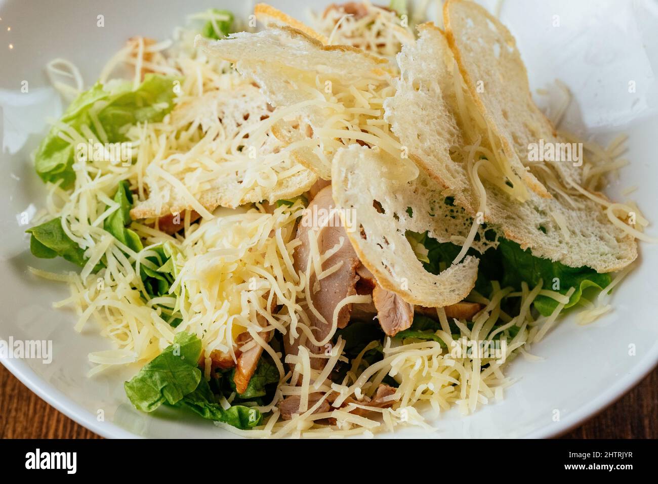 caesar salad with chicken . restaurant menu Stock Photo - Alamy