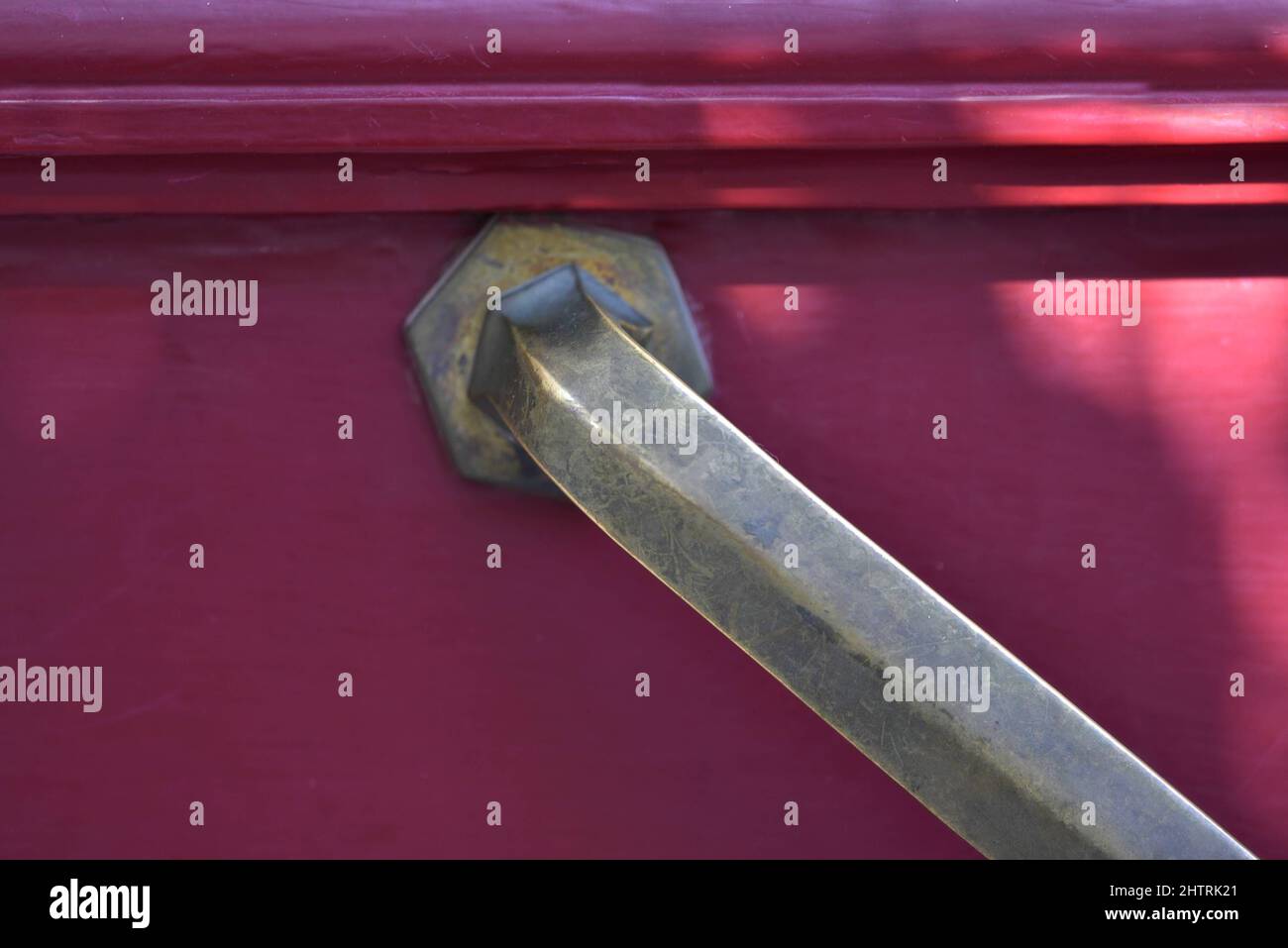 Traditional magenta wooden door with an antique brass handle in Nafplio ...