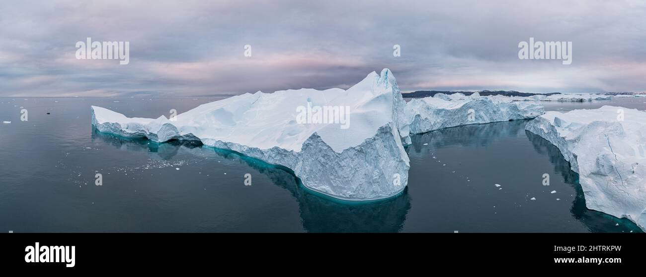 icebergs floating on the sea from aerial point o f view in panoramic ...