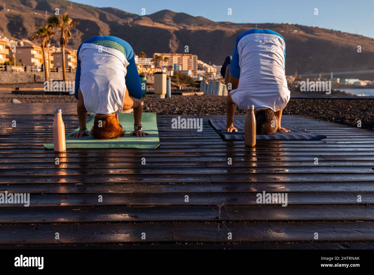 Senior couple doing yoga poses together Stock Photo - Alamy