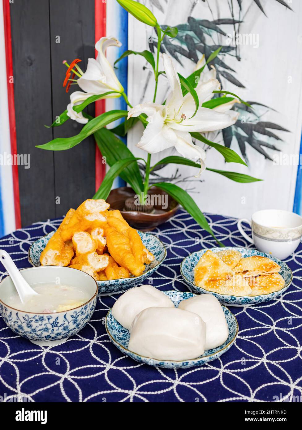 Close up shot of traditional breakfast with steamed bread, congee at ...