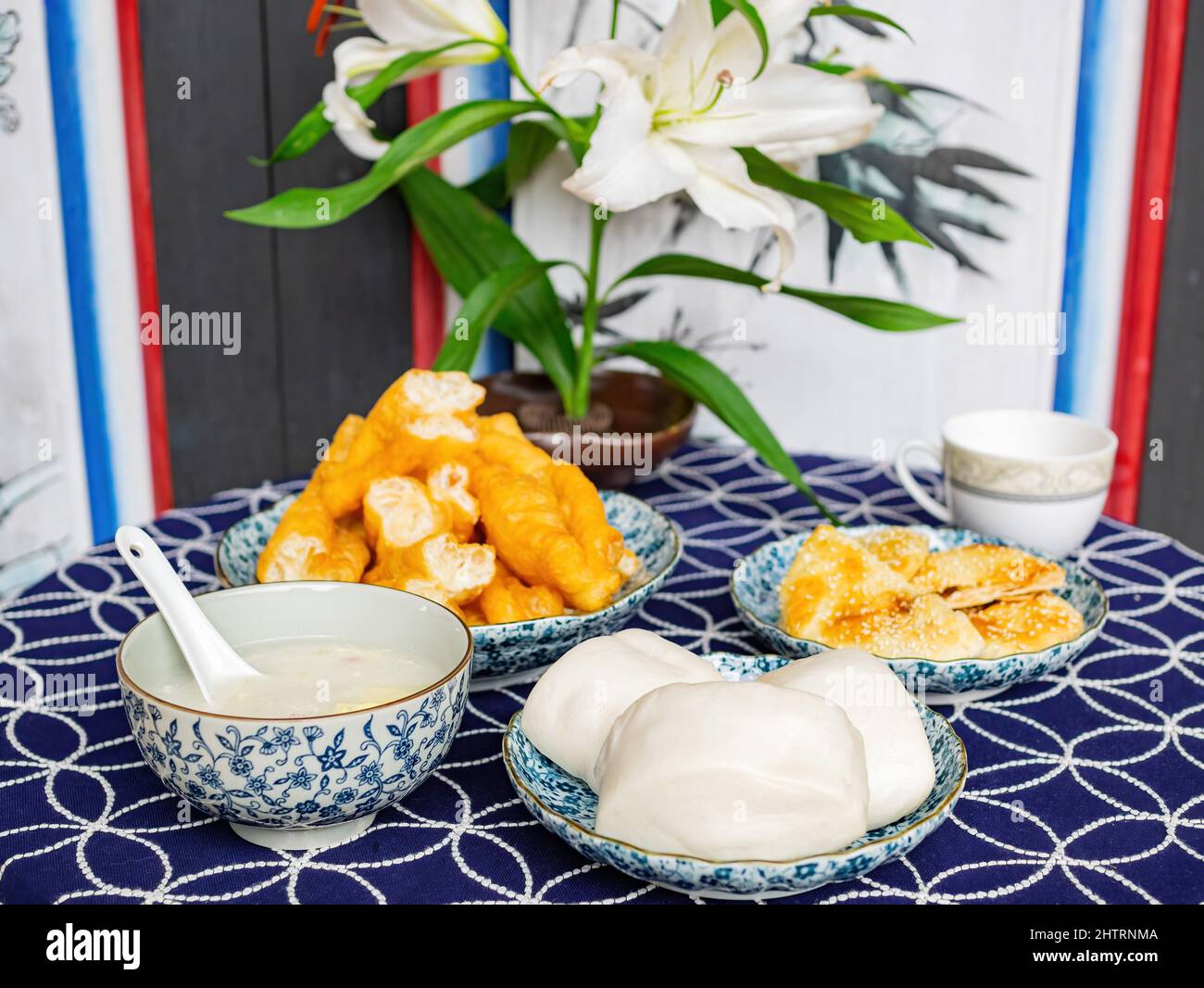 Close up shot of traditional breakfast with steamed bread, congee at ...