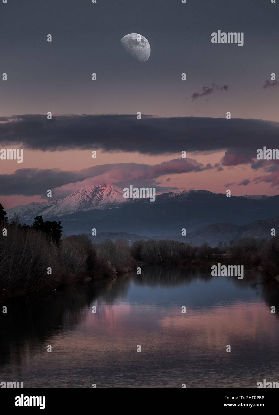 Landscape scenery of the moonrise at sunset time and the reflection of ...