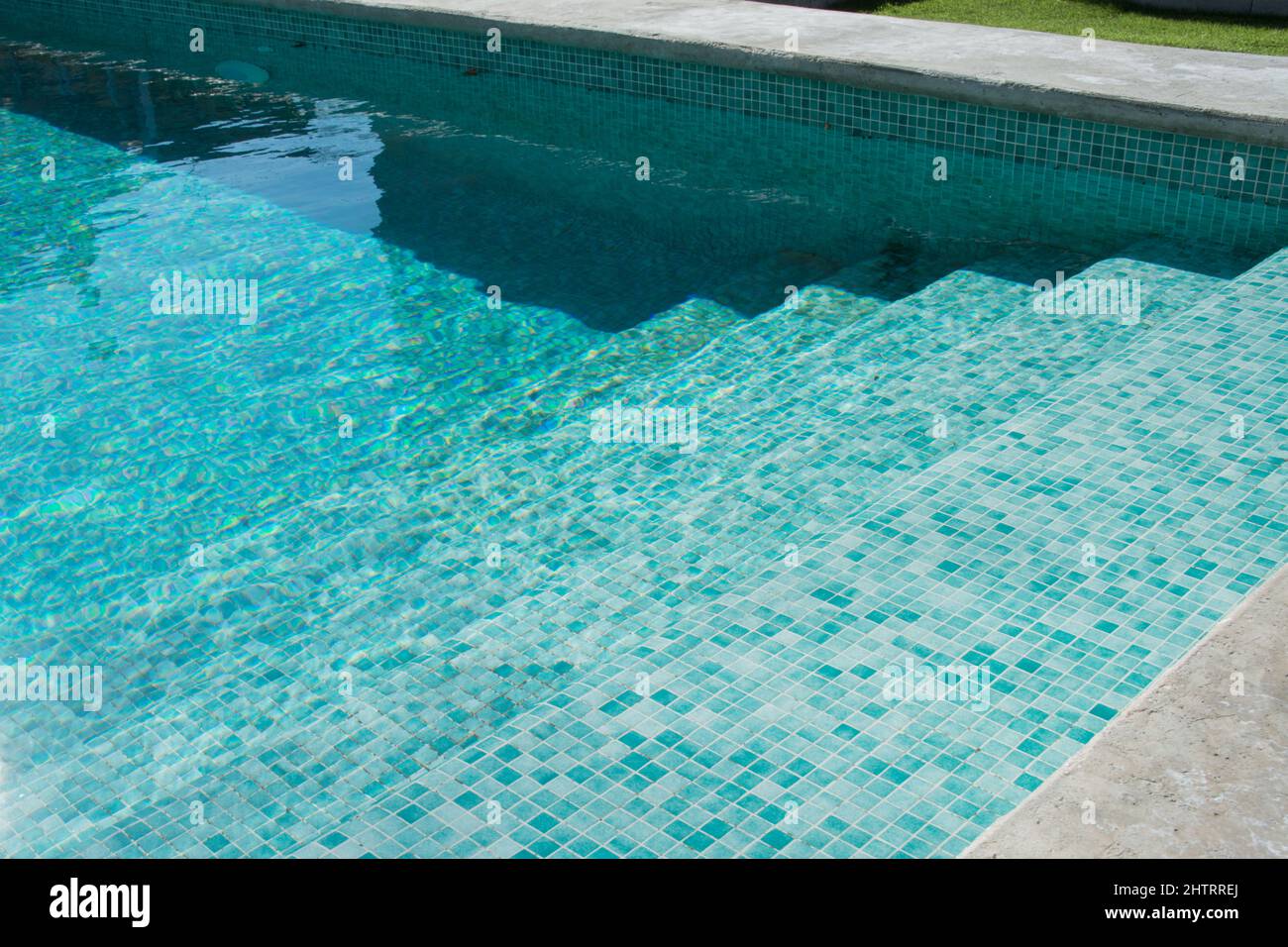Turquoise swimming pool with no people. Sunny day, Spain, Europe Stock ...