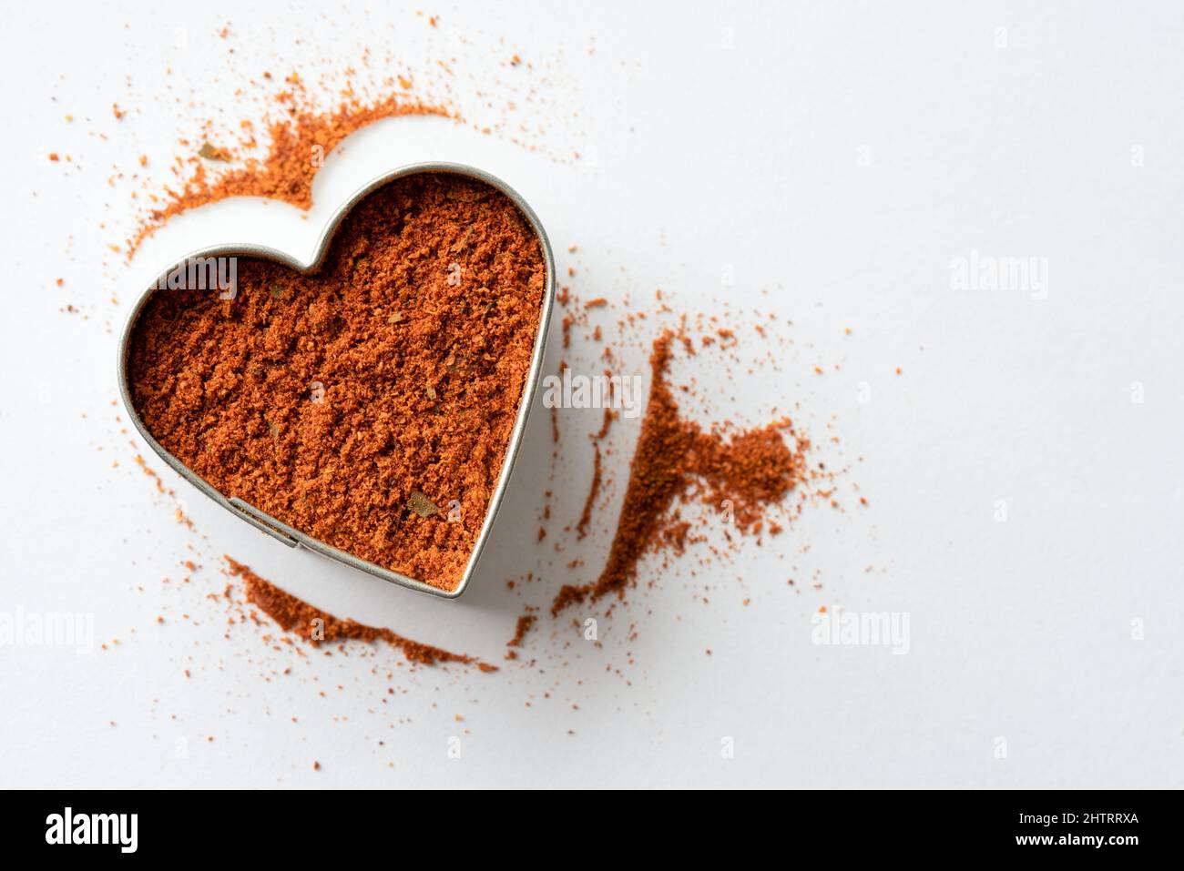 Harissa Seasoning in a Heart Shape Stock Photo - Alamy