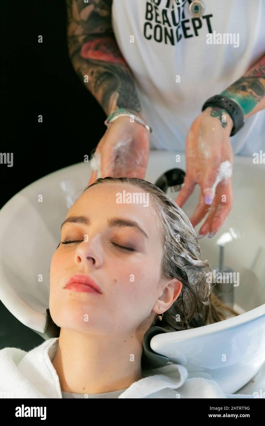 Shot of Female model having hair washed in salon Stock Photo - Alamy