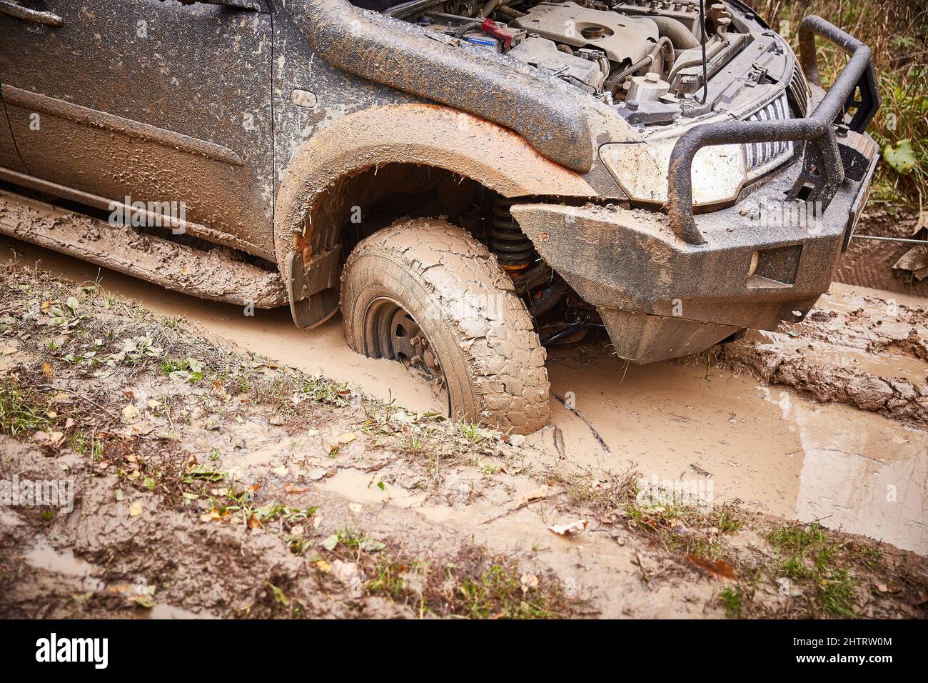 Moscow region, Russia - 28.09.2018. SUV got stuck in a dirty rut on the ...