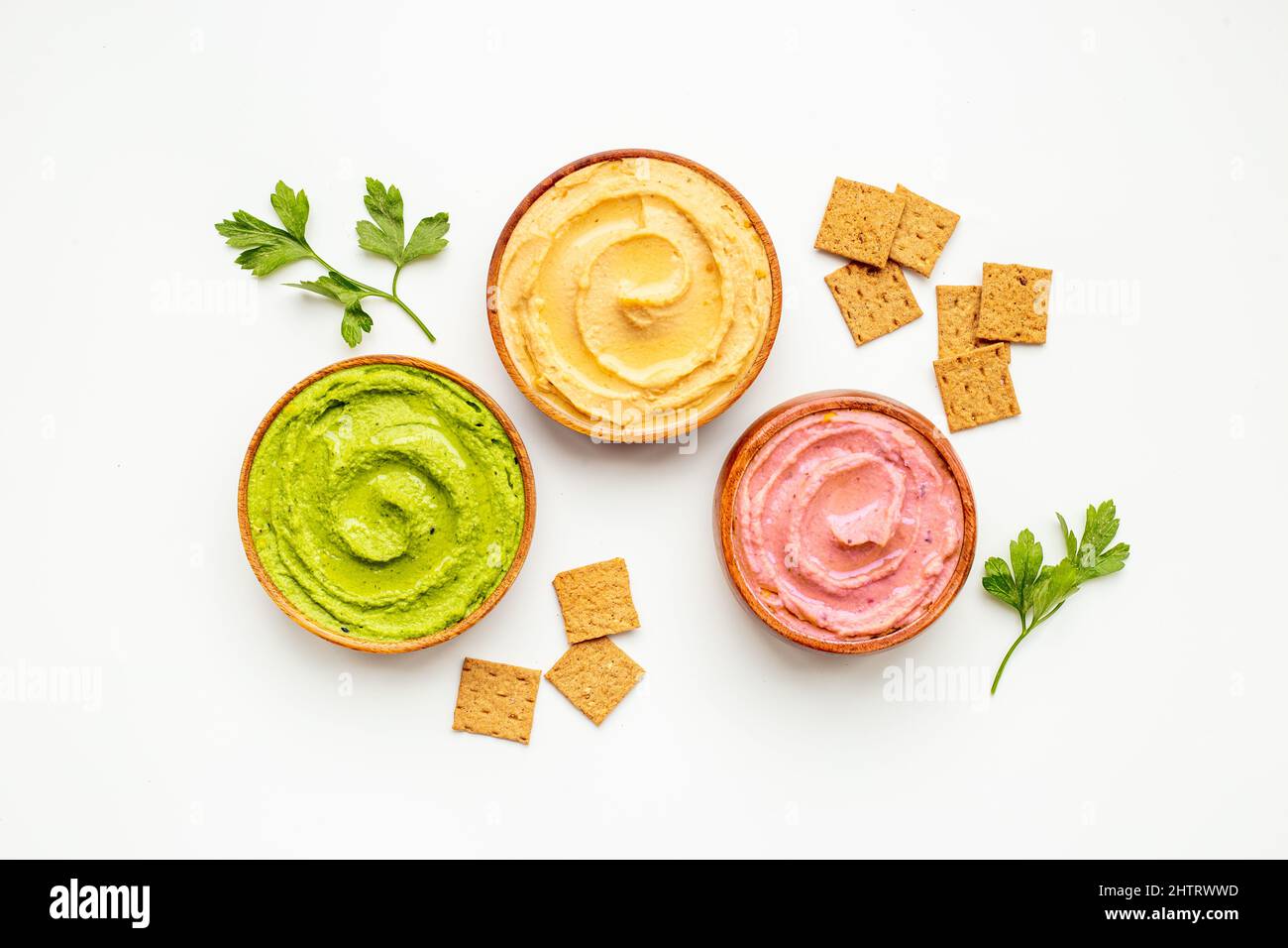 Various types of hummus with chickpeas spinach and beets. Flatlay top ...