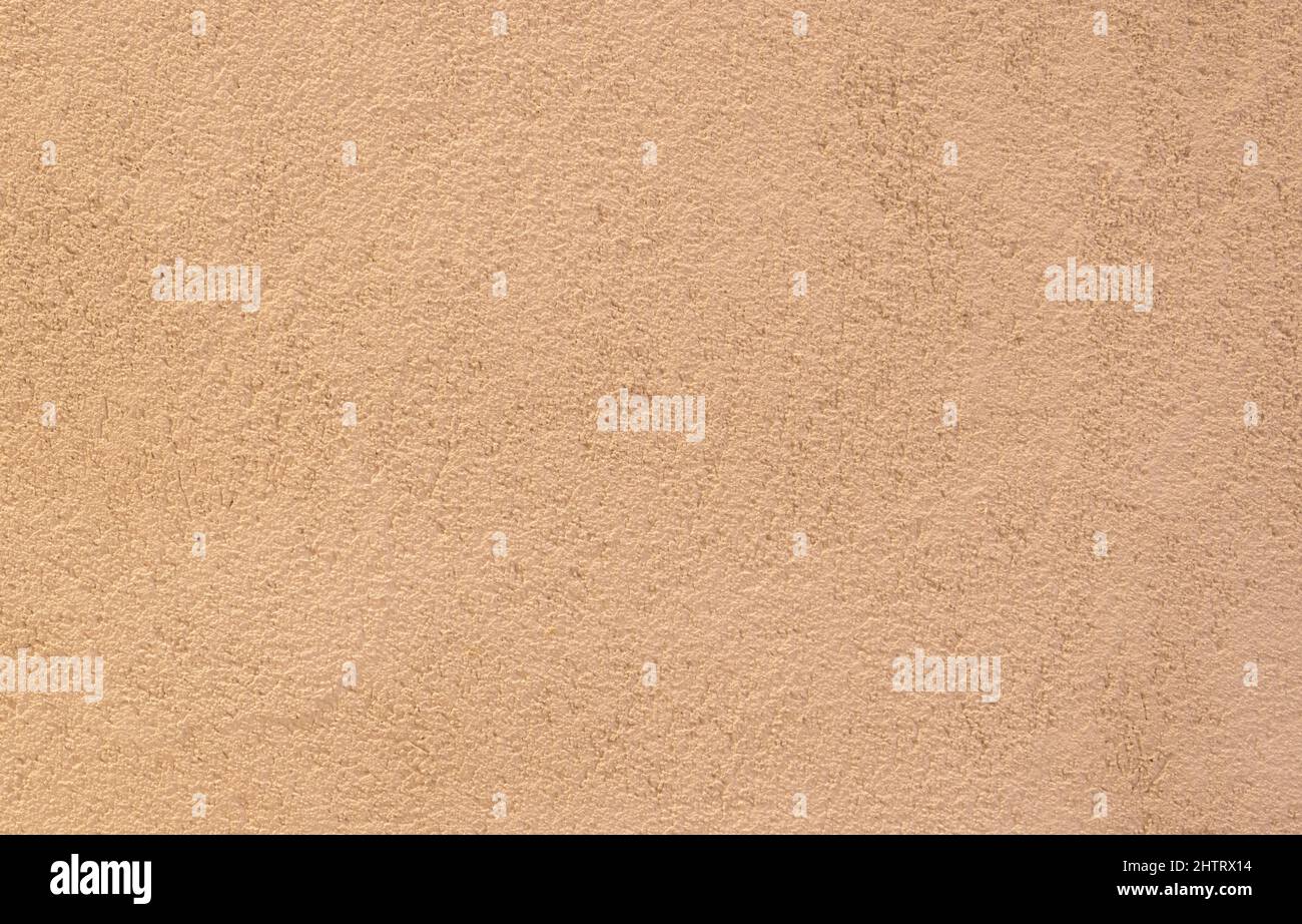 Rough grainy painted sand colored plaster wall background Stock Photo ...