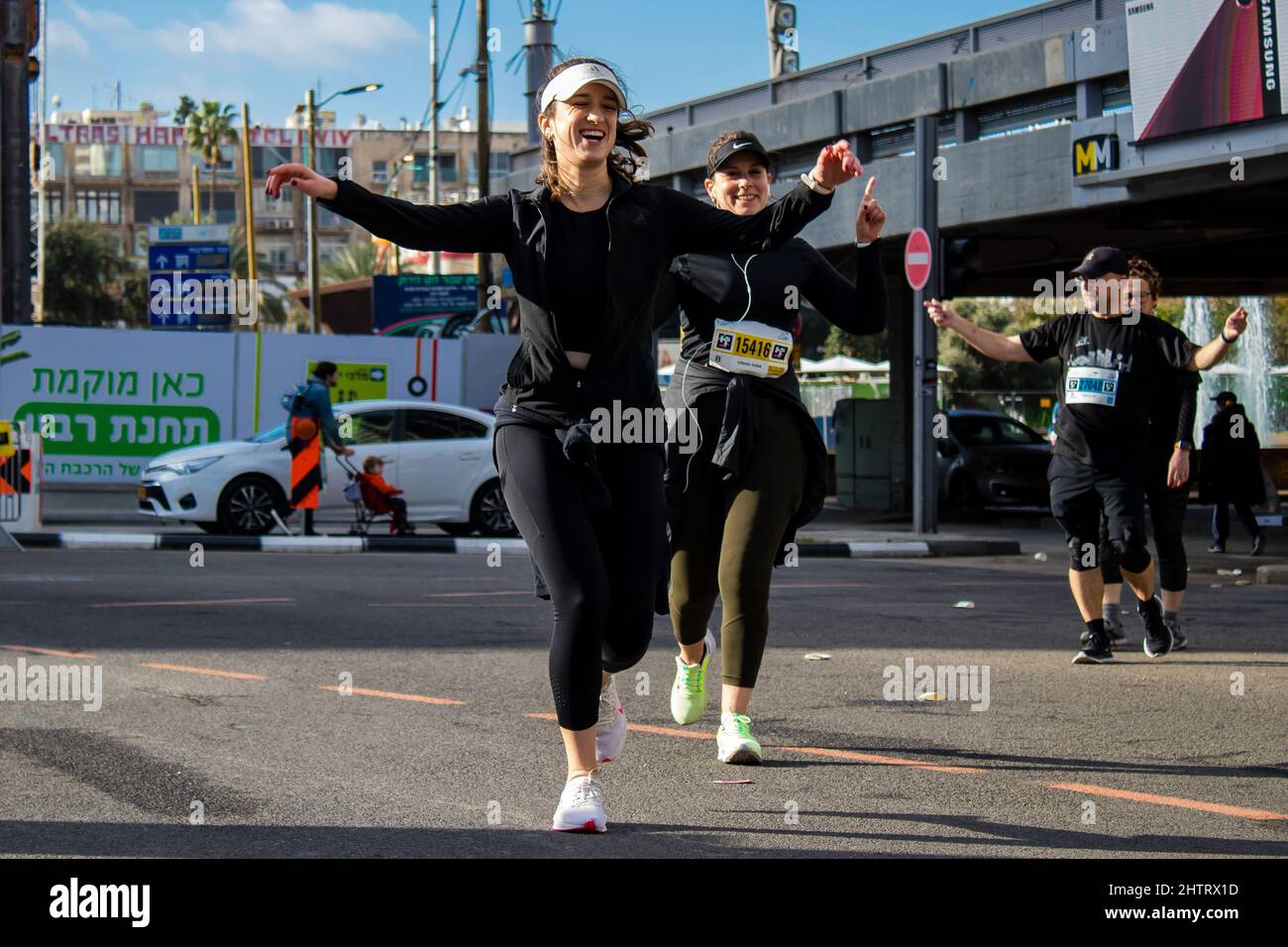 Tel Aviv, Israel - February 25, 2022 Runners in the street of Tel Aviv ...