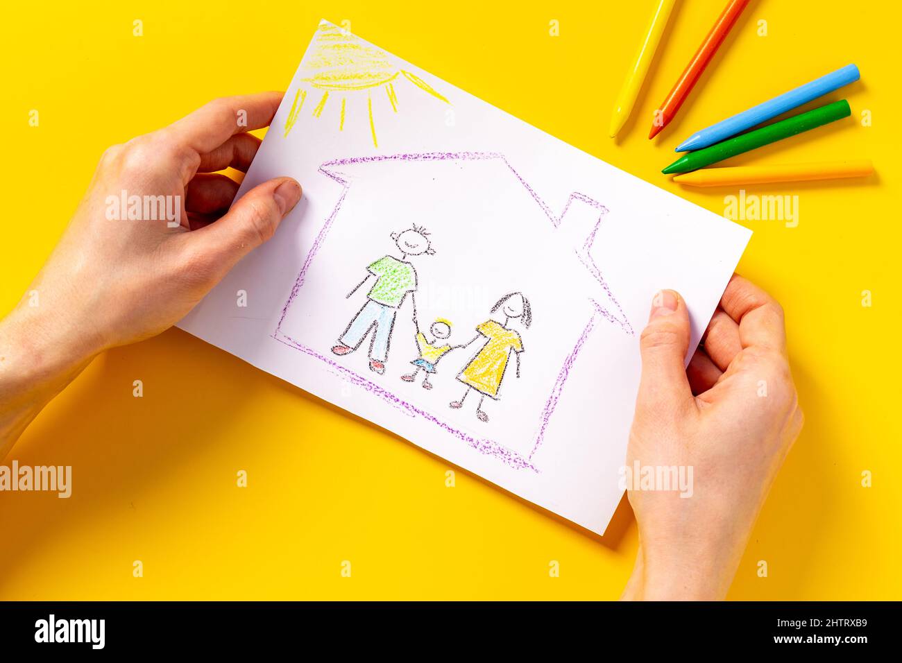 Drawing of parents and child at home. Adoption concept Stock Photo - Alamy