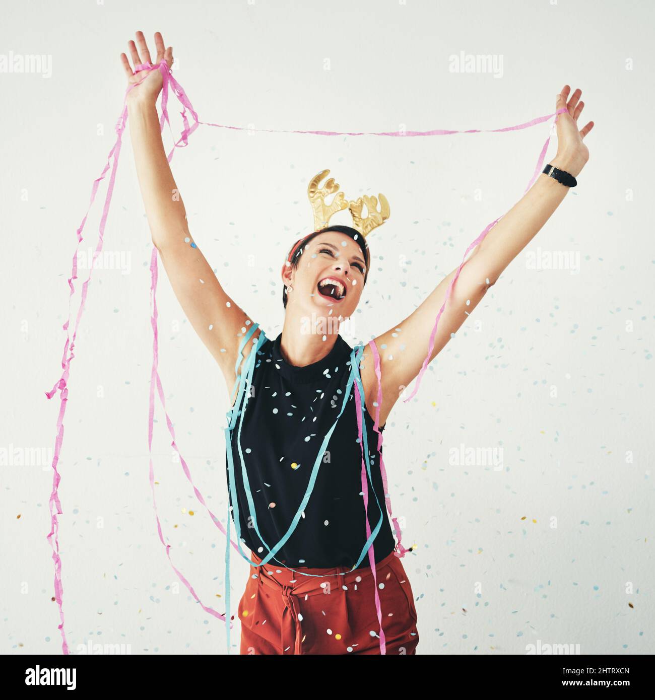 Woman celebrating confetti falling hi-res stock photography and images ...