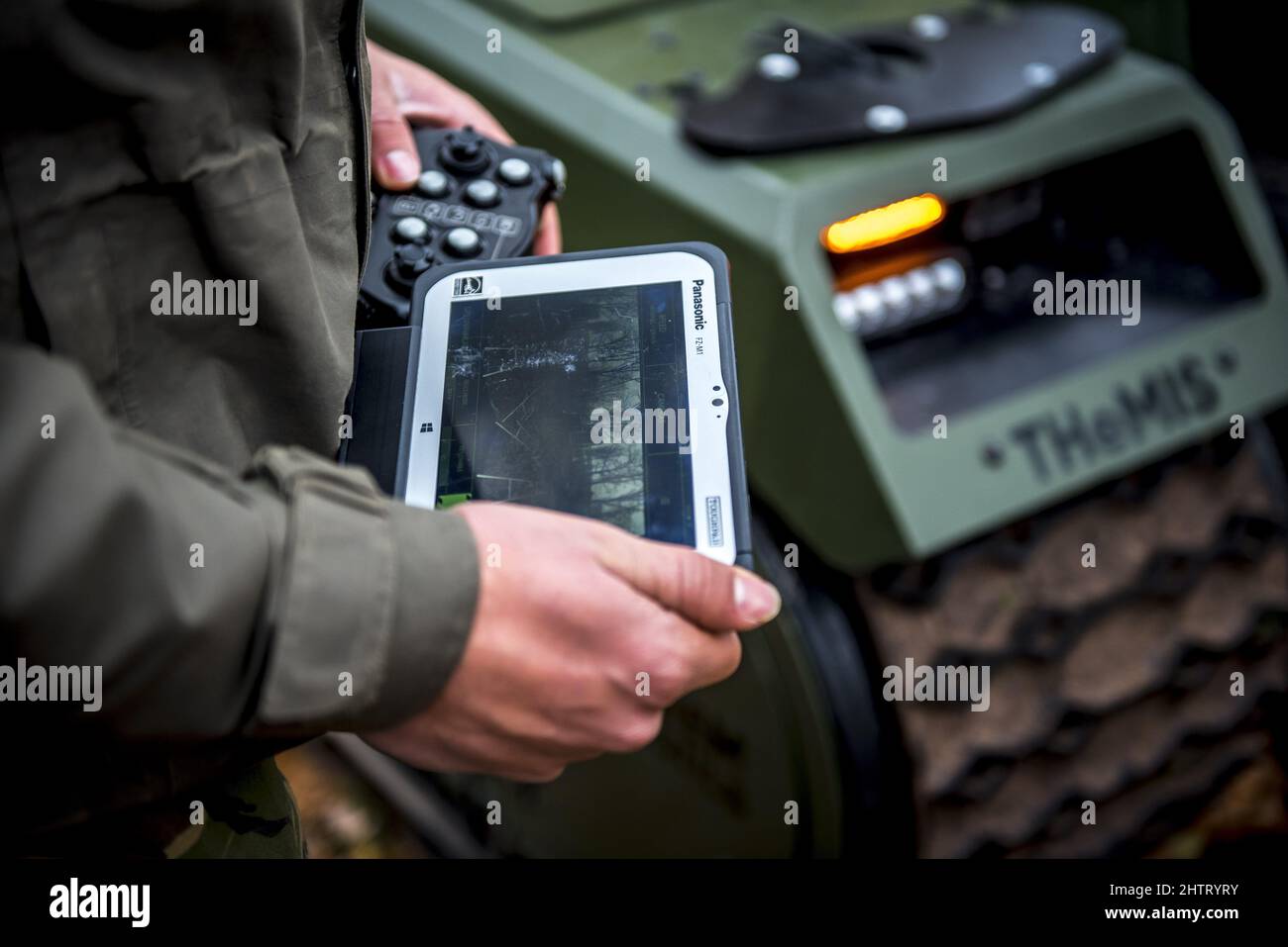 Army soldiers being trained to operate a Milrem Robotics THeMIs UGV ...