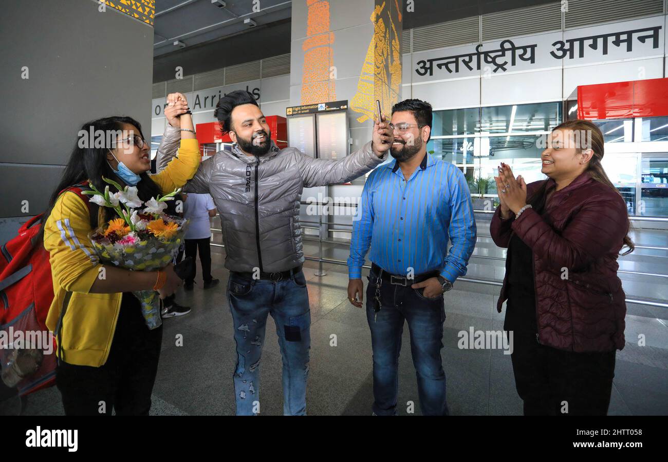 New Delhi, India. 02nd Mar, 2022. Kanchan Saini (L) Indian student poses for a photograph with ...